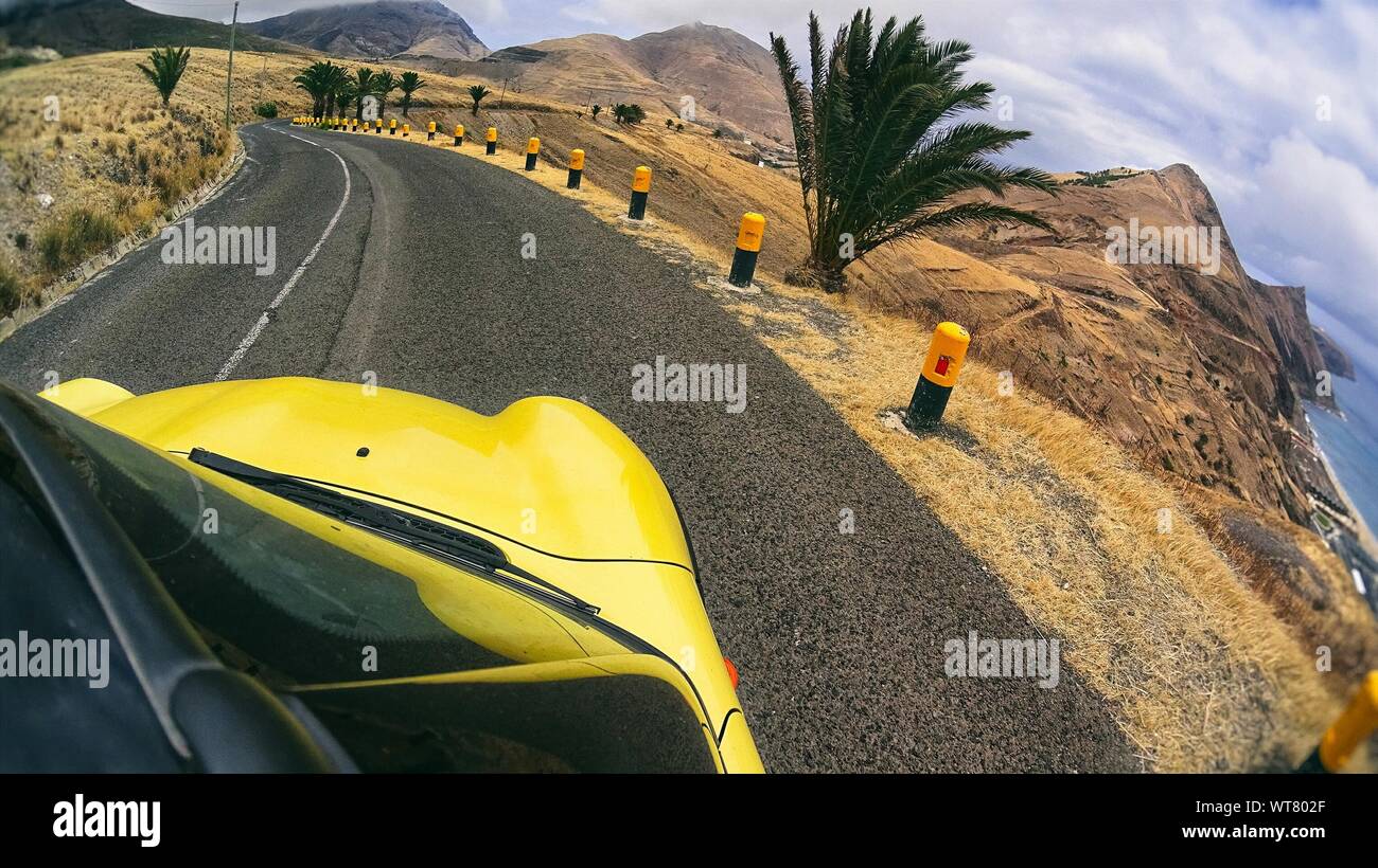 Yellow car mountain road hi-res stock photography and images - Alamy