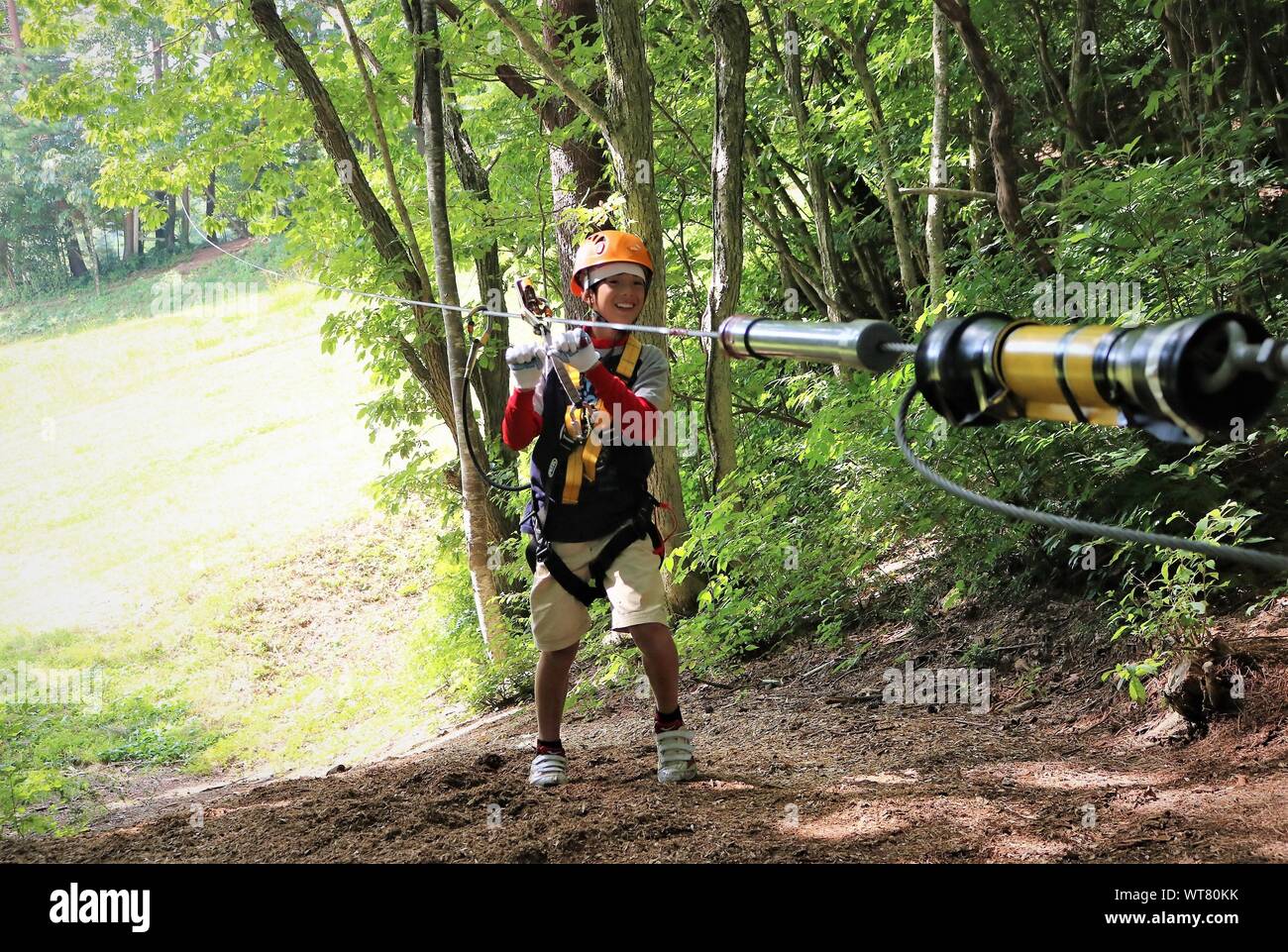 Child zip lining hi-res stock photography and images - Alamy