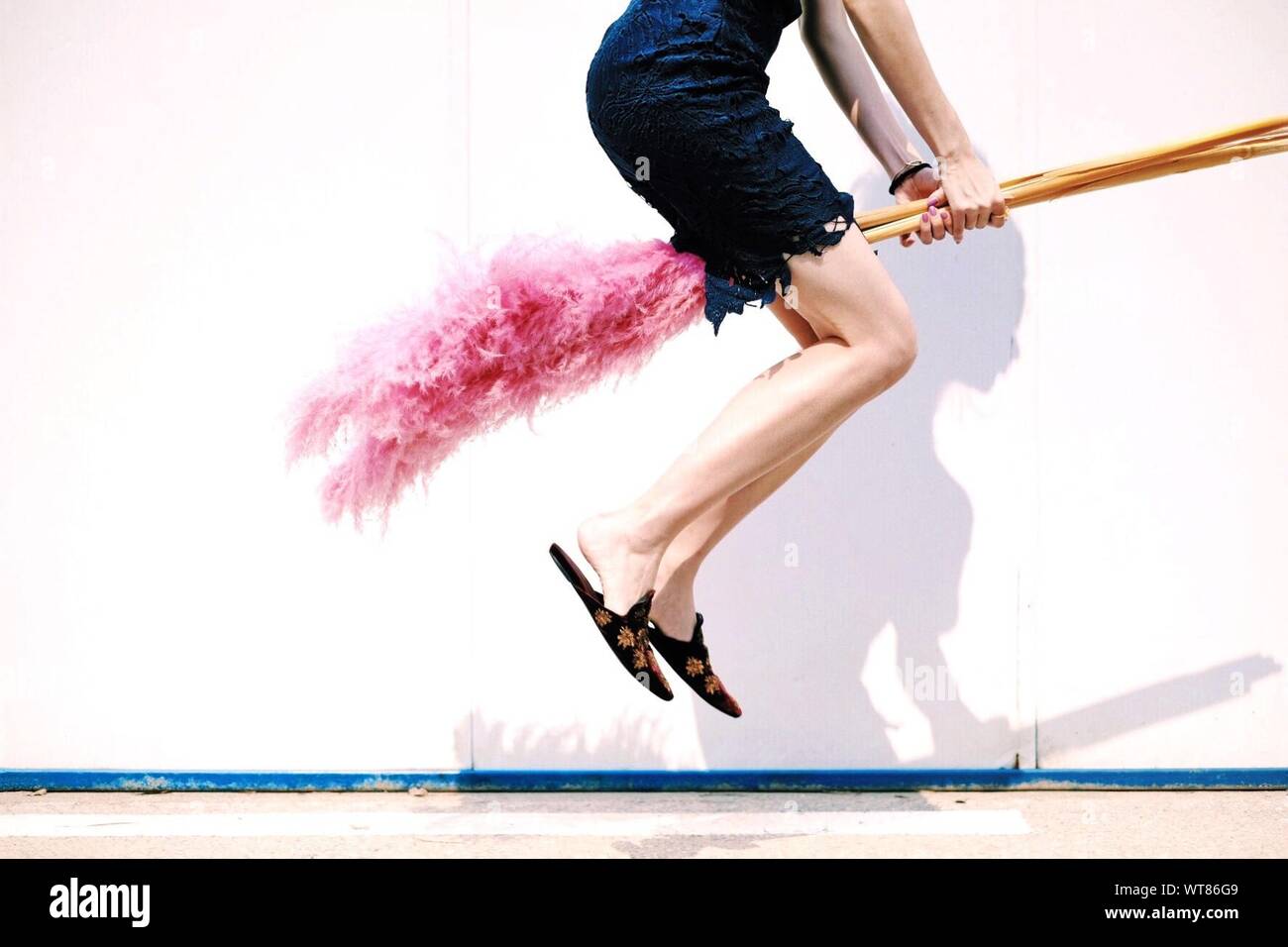 Woman holding broom hi-res stock photography and images - Alamy