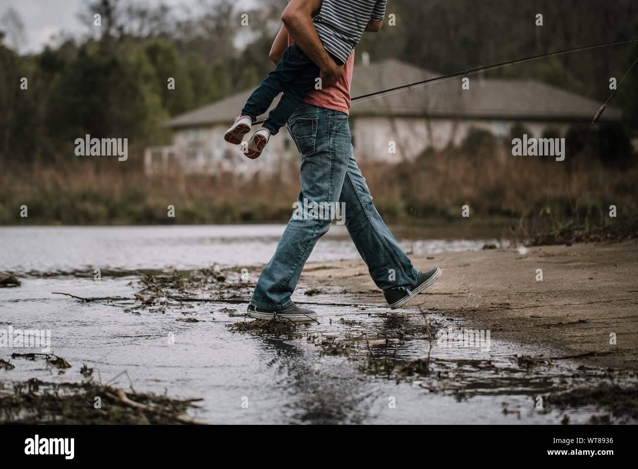 Man carrying child hi-res stock photography and images - Alamy