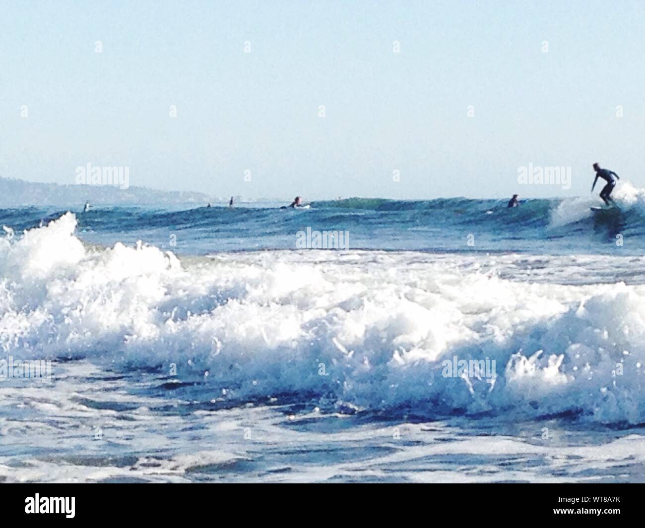 People Surfing On Wave Stock Photo - Alamy