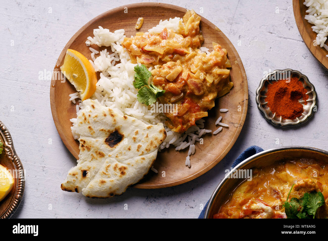 Indian cuisine: chicken tikka masala with rice and naan bread and ...