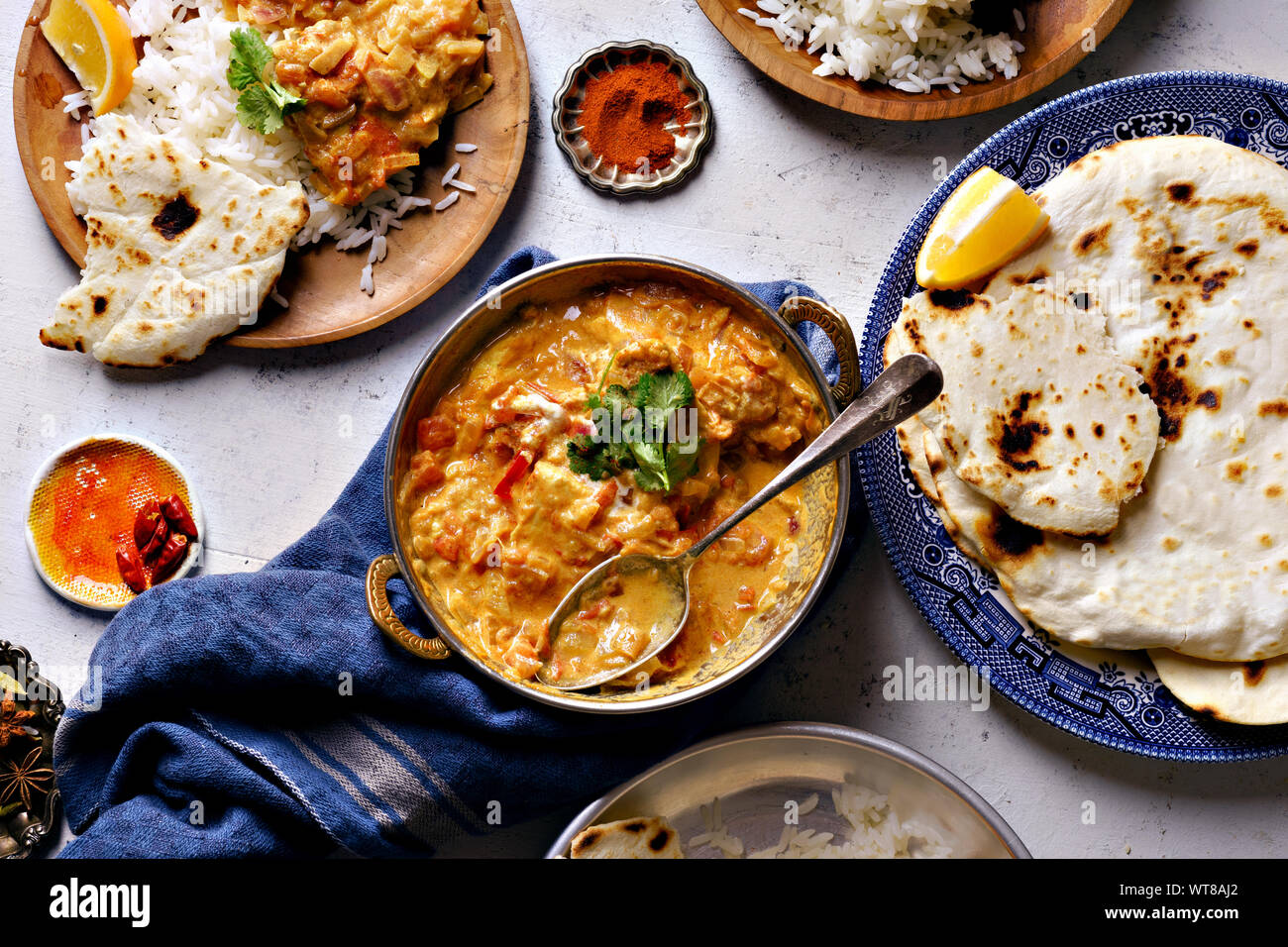 Indian cuisine: chicken tikka masala with rice and naan bread and ...