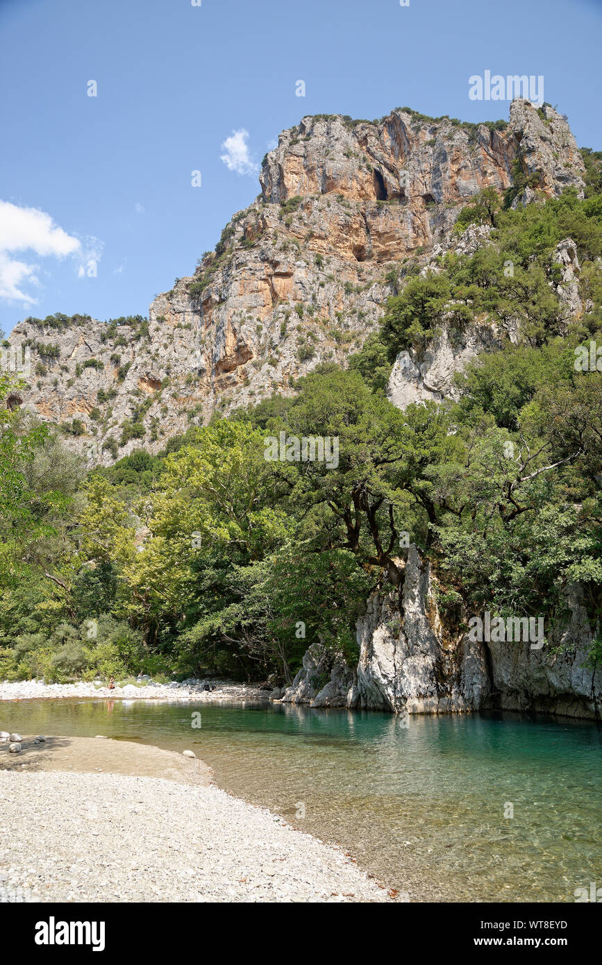 The Voidomatis river in Northern Greece. Travel between the road from ...