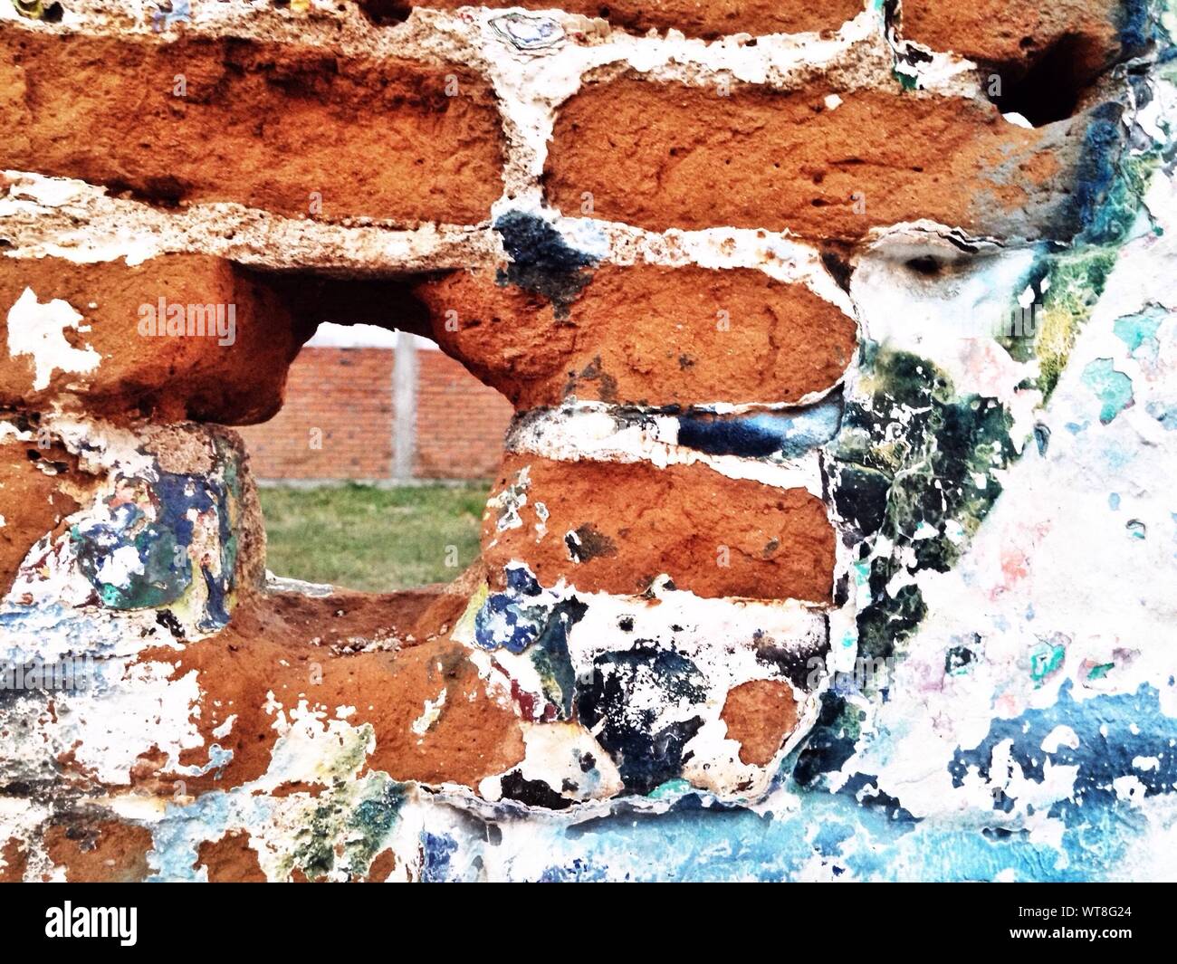 Hole brick wall hi-res stock photography and images - Alamy
