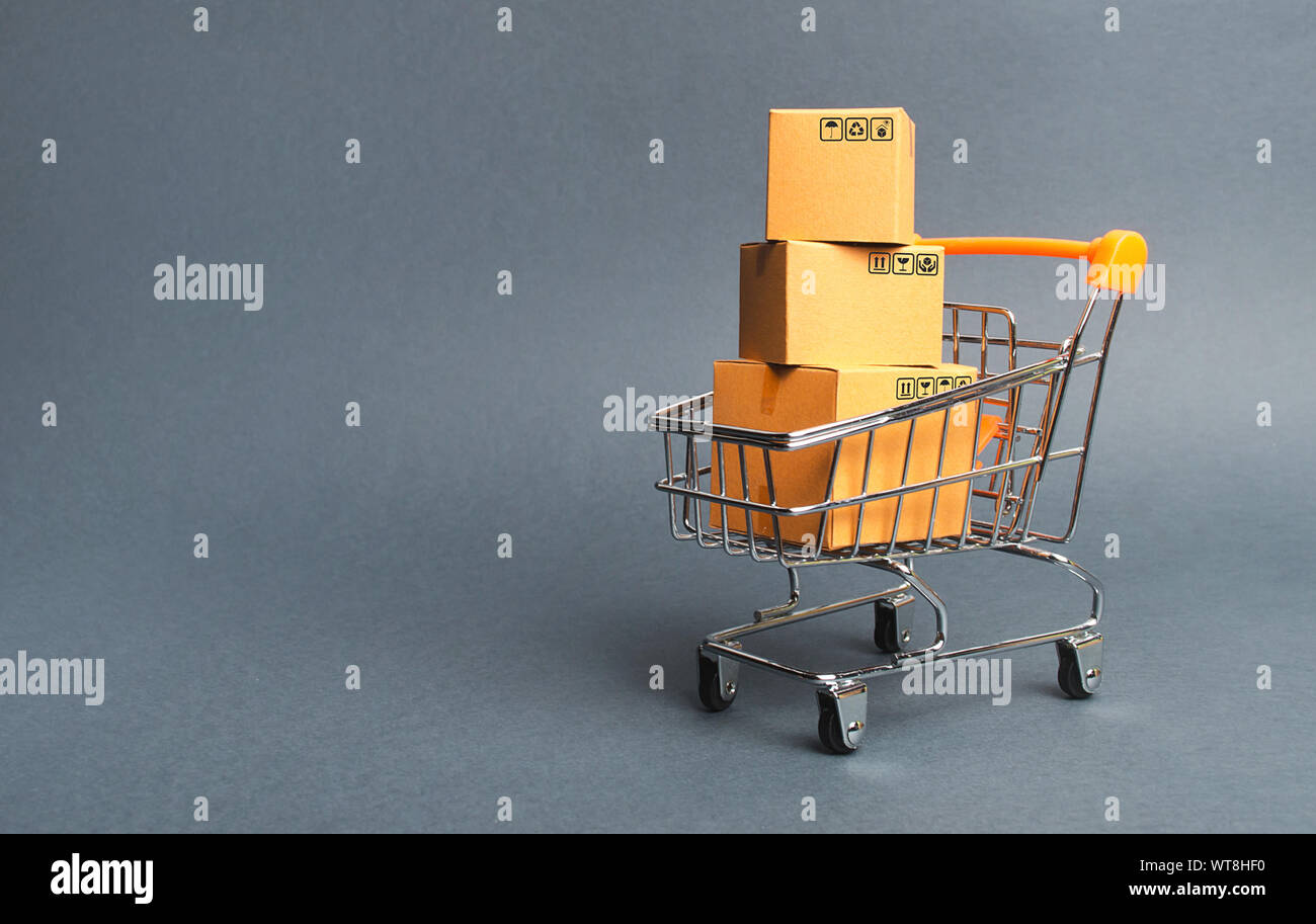 Pile cardboard boxes shopping trolley hi-res stock photography and ...