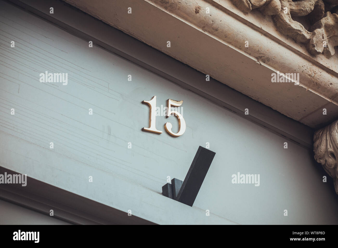 number 15 door sign in golden letter Stock Photo - Alamy