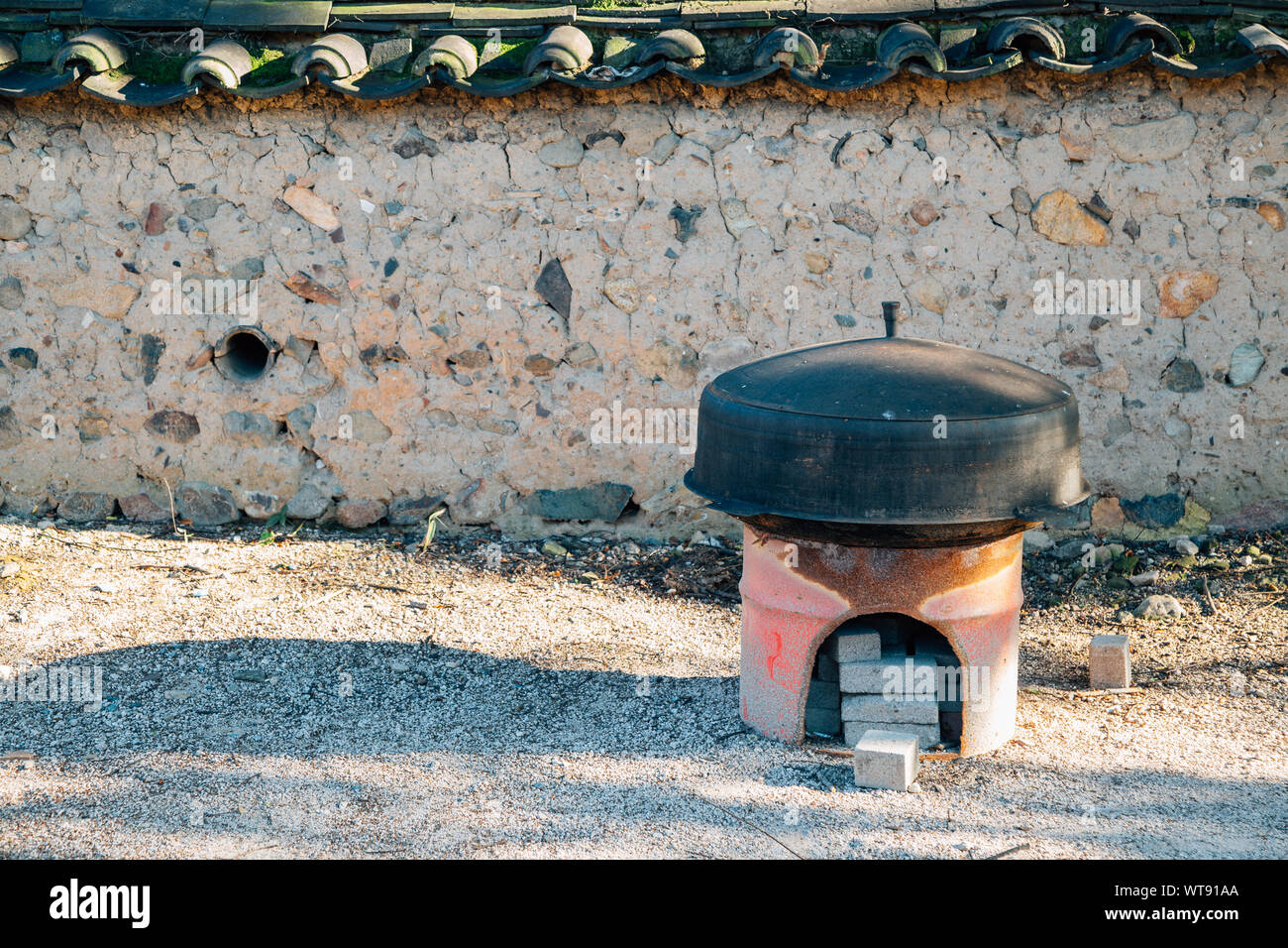Iron pot and Korean traditional fireplace at Gyochon Hanok Village in ...