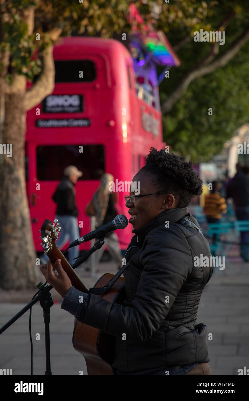 Female Busker Playing Guitar High Resolution Stock Photography and ...