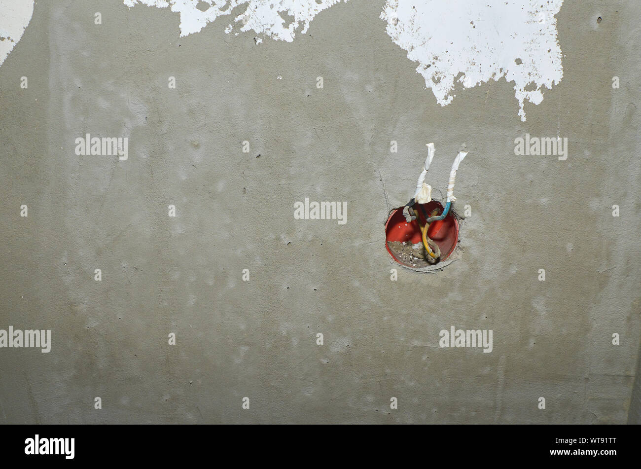 Electric wires jutted out from its box in a wall during renovation ...
