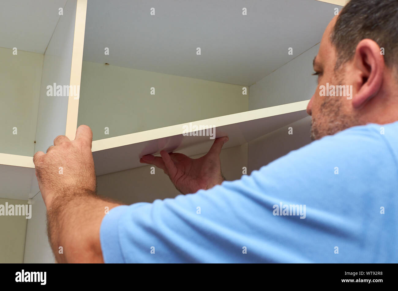 Installing shelves hi-res stock photography and images - Alamy