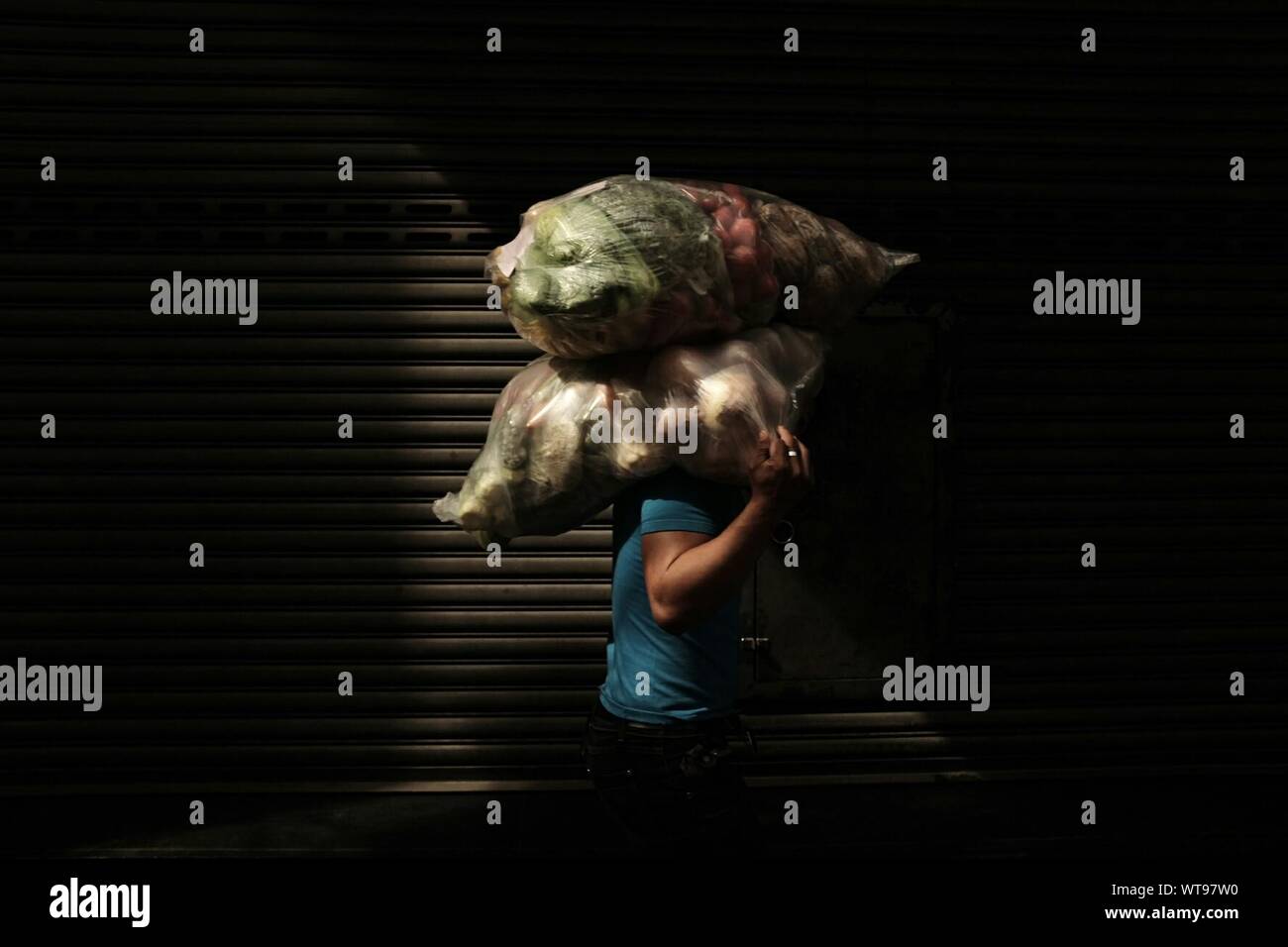Man carrying sacks hi-res stock photography and images - Alamy