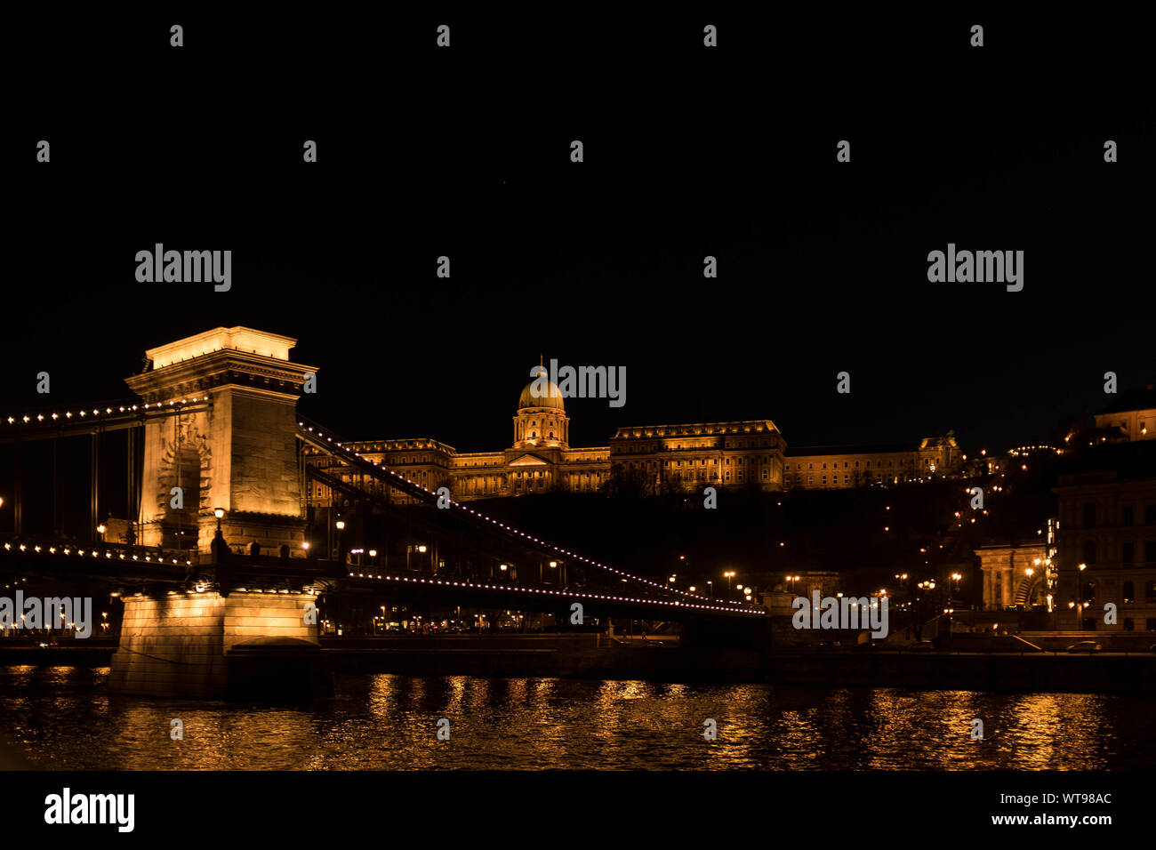 Illuminated Buda castle and Chain bridge during night, a view from ...