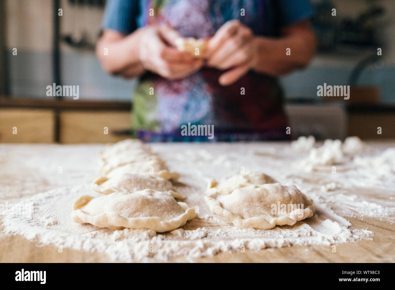 Old woman making traditional pierogi hi-res stock photography and ...