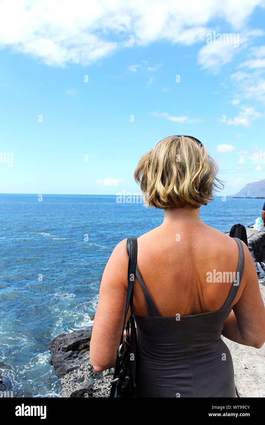Mature woman rear view looking at sky hi-res stock photography and ...