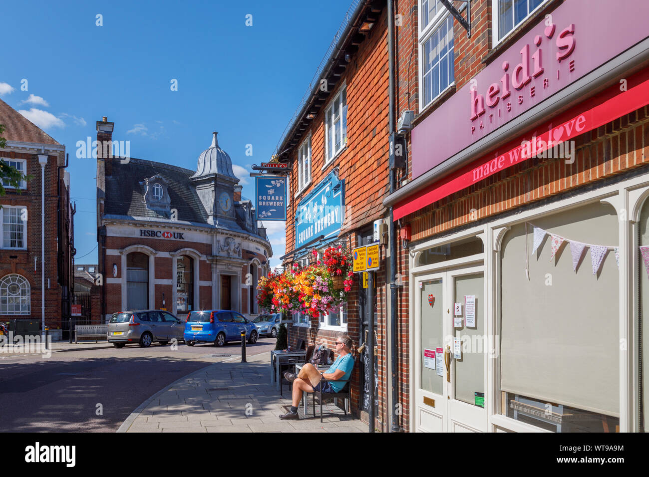 The Square Brewery decorated with pretty hanging baskets in the centre ...
