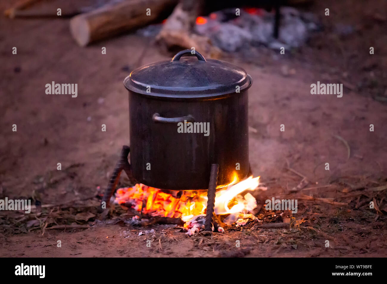 metal pot on fire at outdoor Stock Photo - Alamy