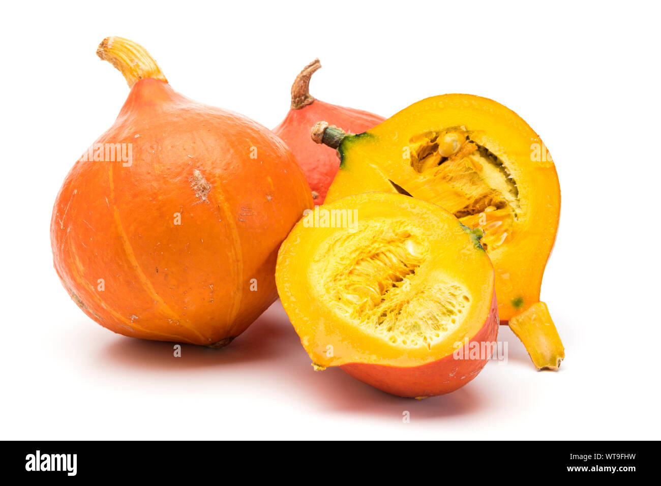 Whole and half Red Kuri squash isolated on white background Stock Photo ...