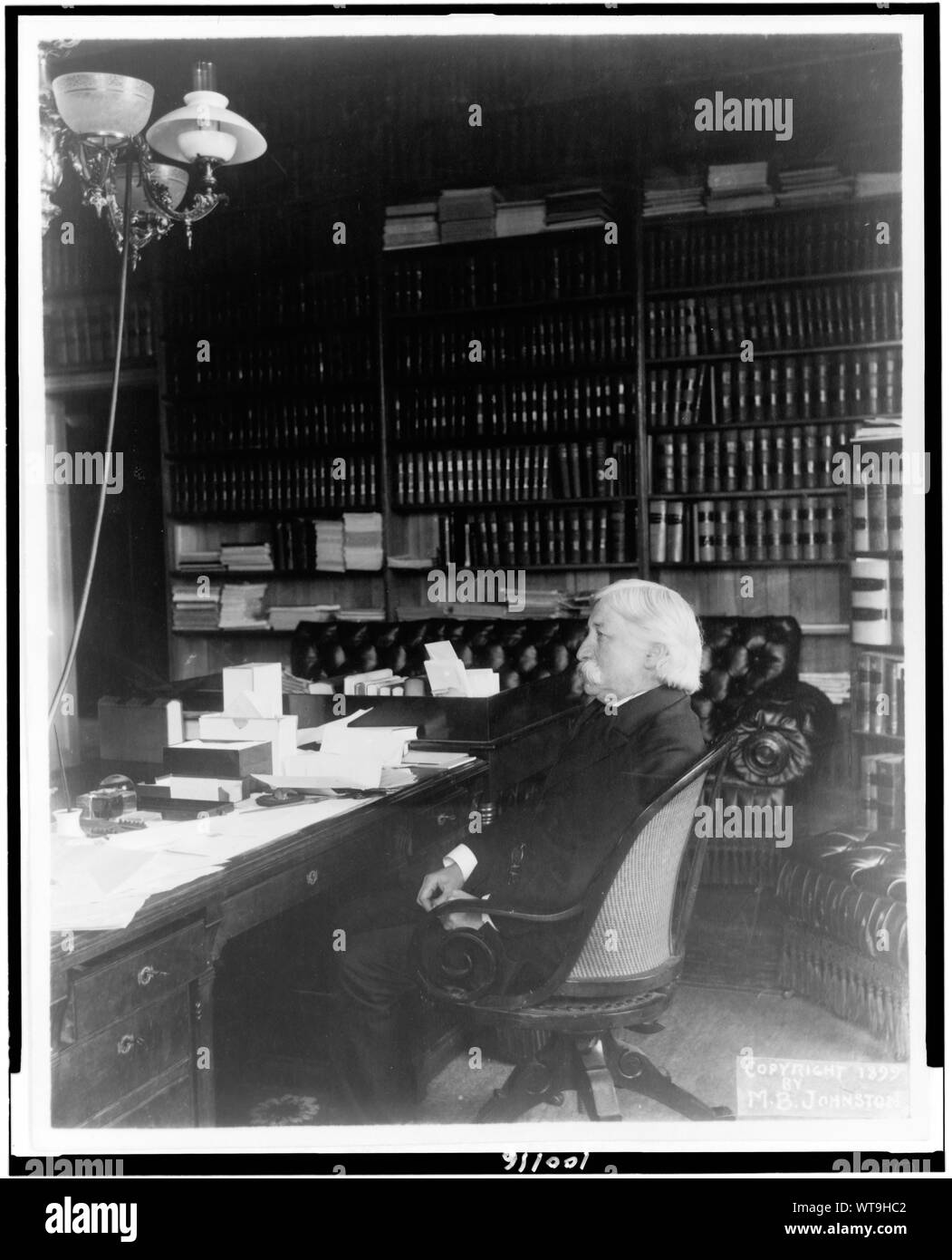 Melville Weston Fuller, full-length portrait, seated at desk, facing ...