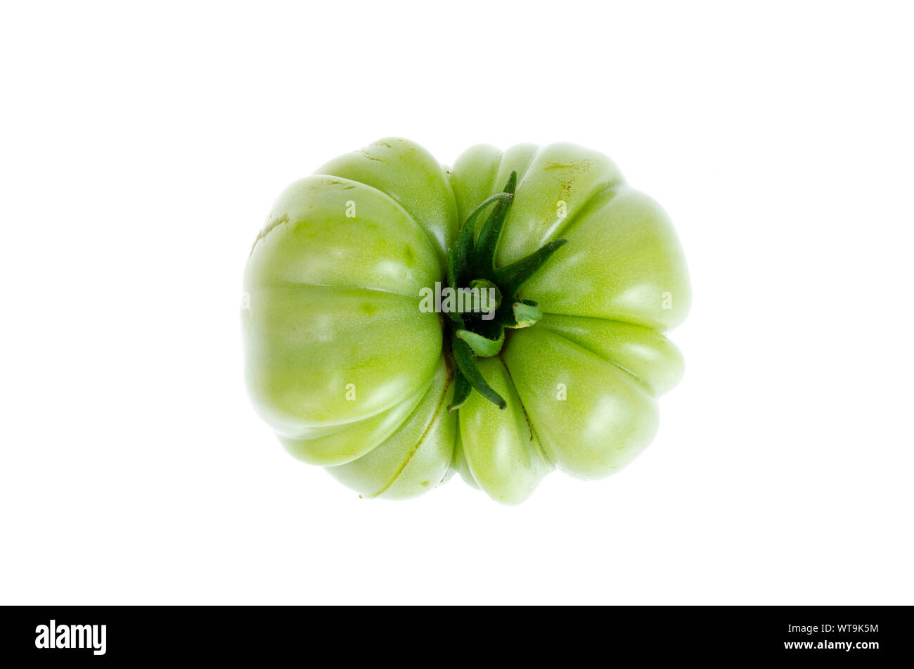 Green unripe tomato isolated on white background. Studio Photo Stock ...