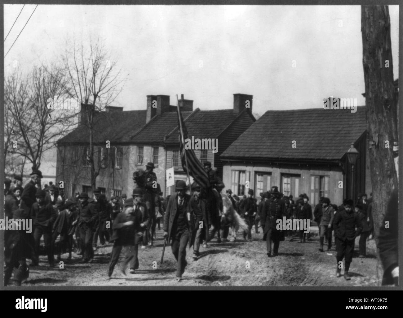 Members of Coxey's Army: men and boys, with flag bearer in center Stock ...