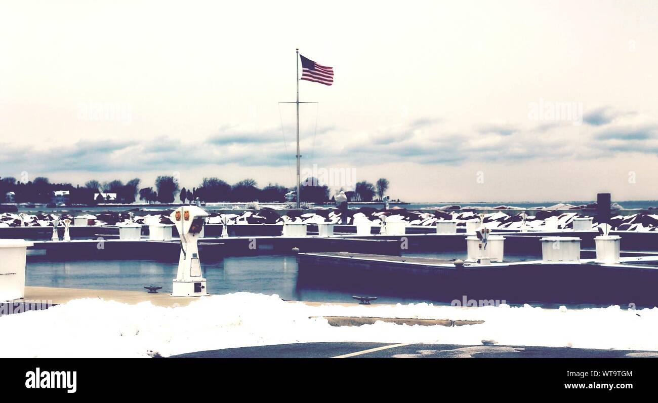 American flag in winter with snow hi-res stock photography and images ...