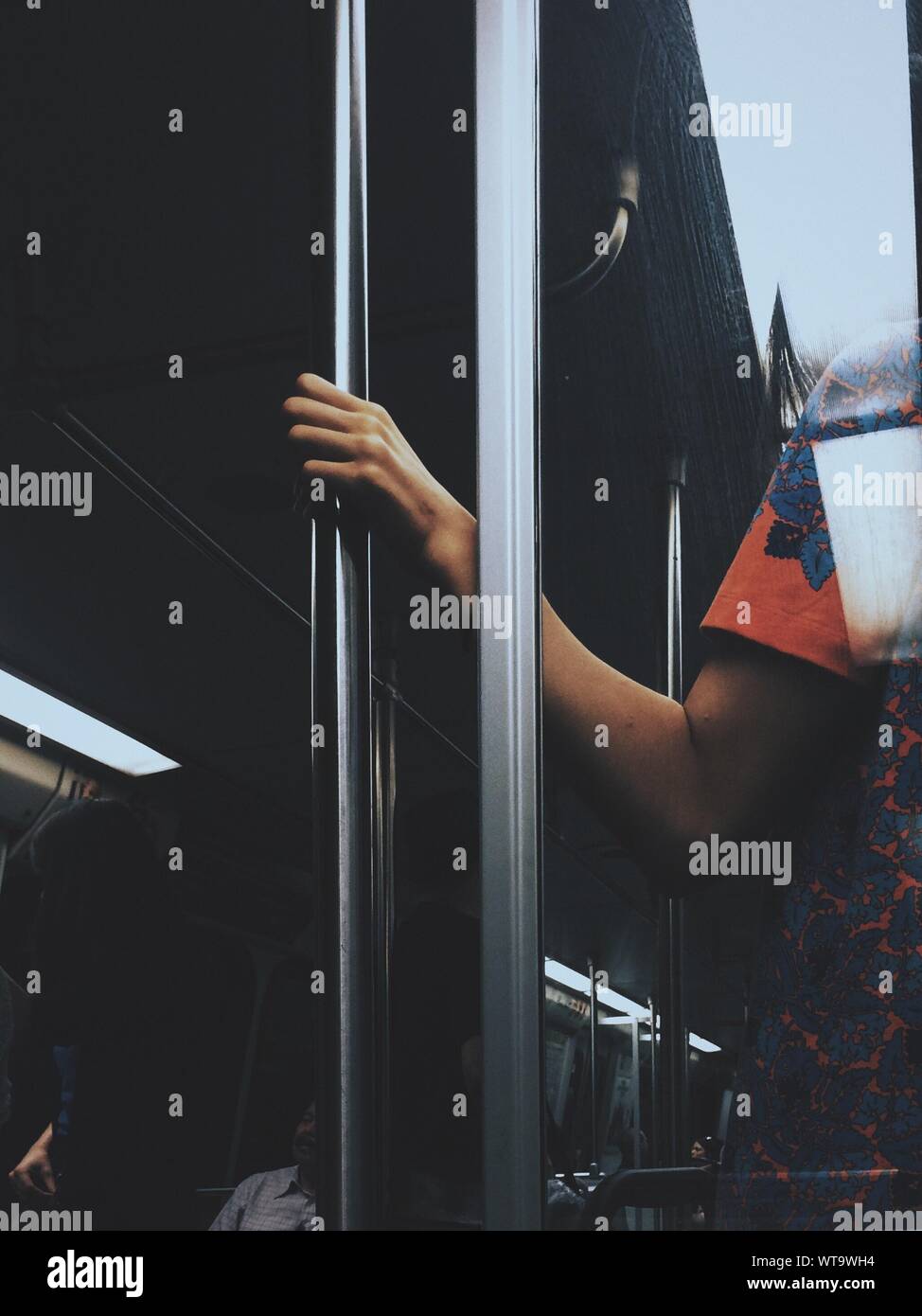 Holding train pole hi-res stock photography and images - Alamy