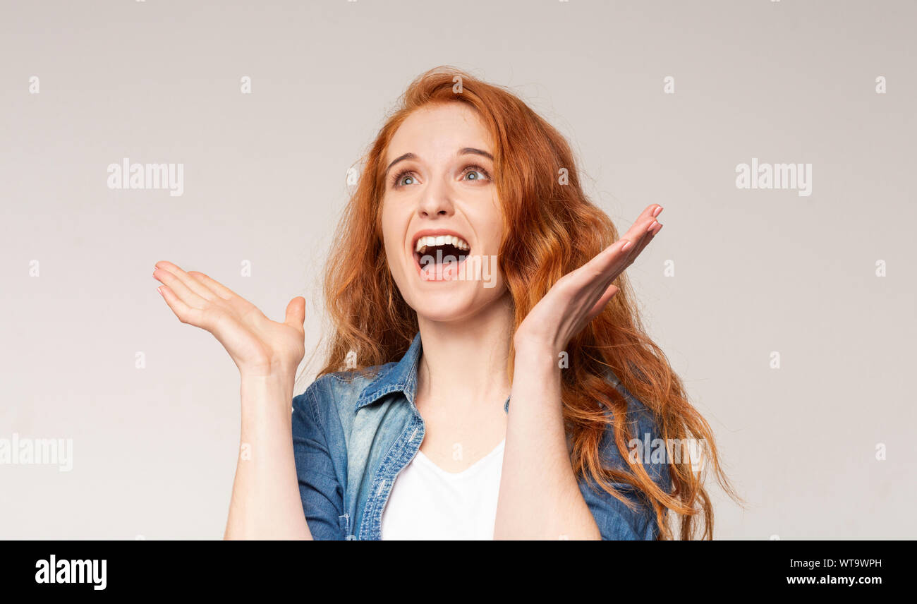 Joyful Girl Screaming In Delight On Light Studio Background Stock Photo ...