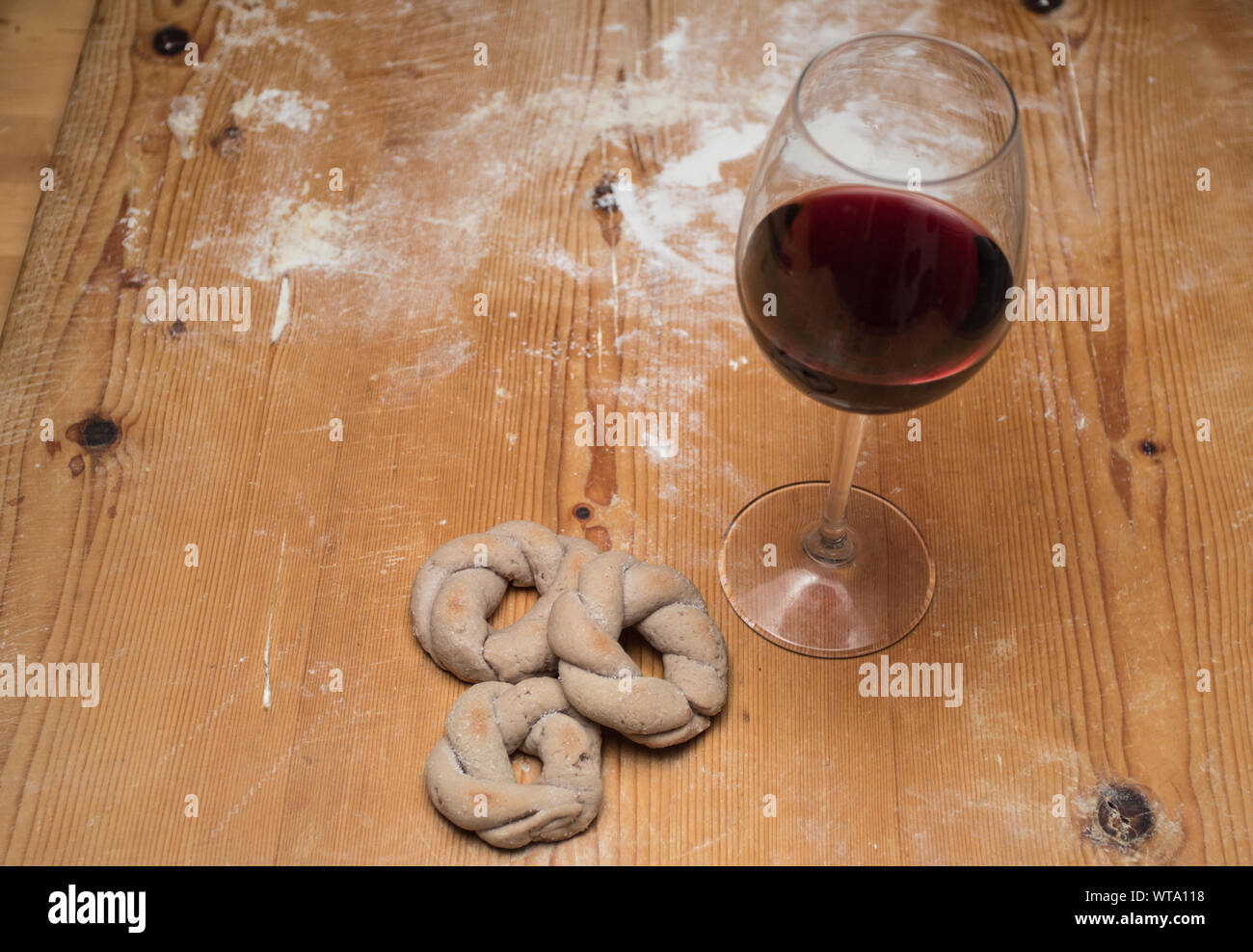 Italian red wine ciambelline biscuits, cooked, with red wine glass on ...
