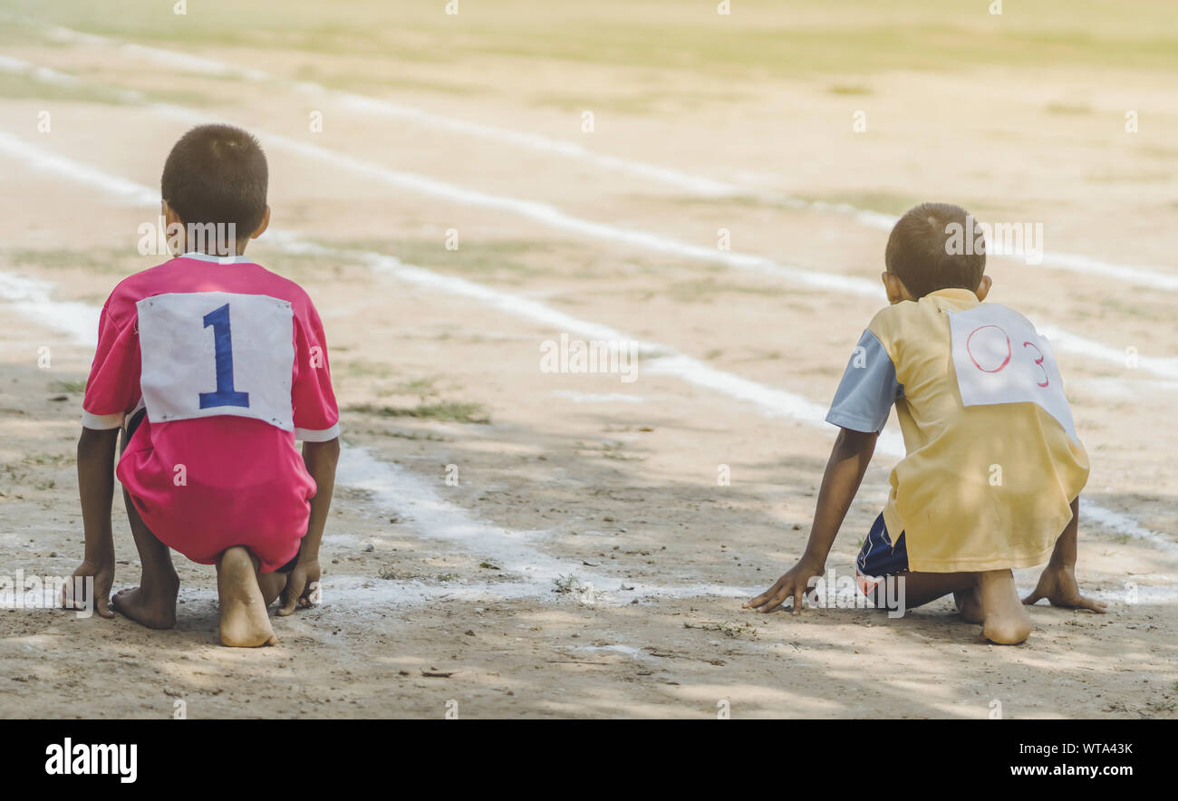 Students fitness training for sprinting on an athletic track in school ...