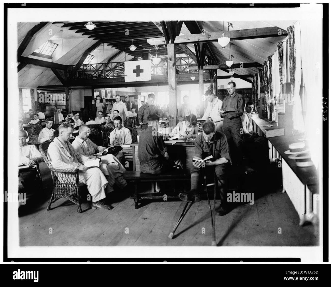 Men reading in war library service section, Red Cross Building, Walter ...