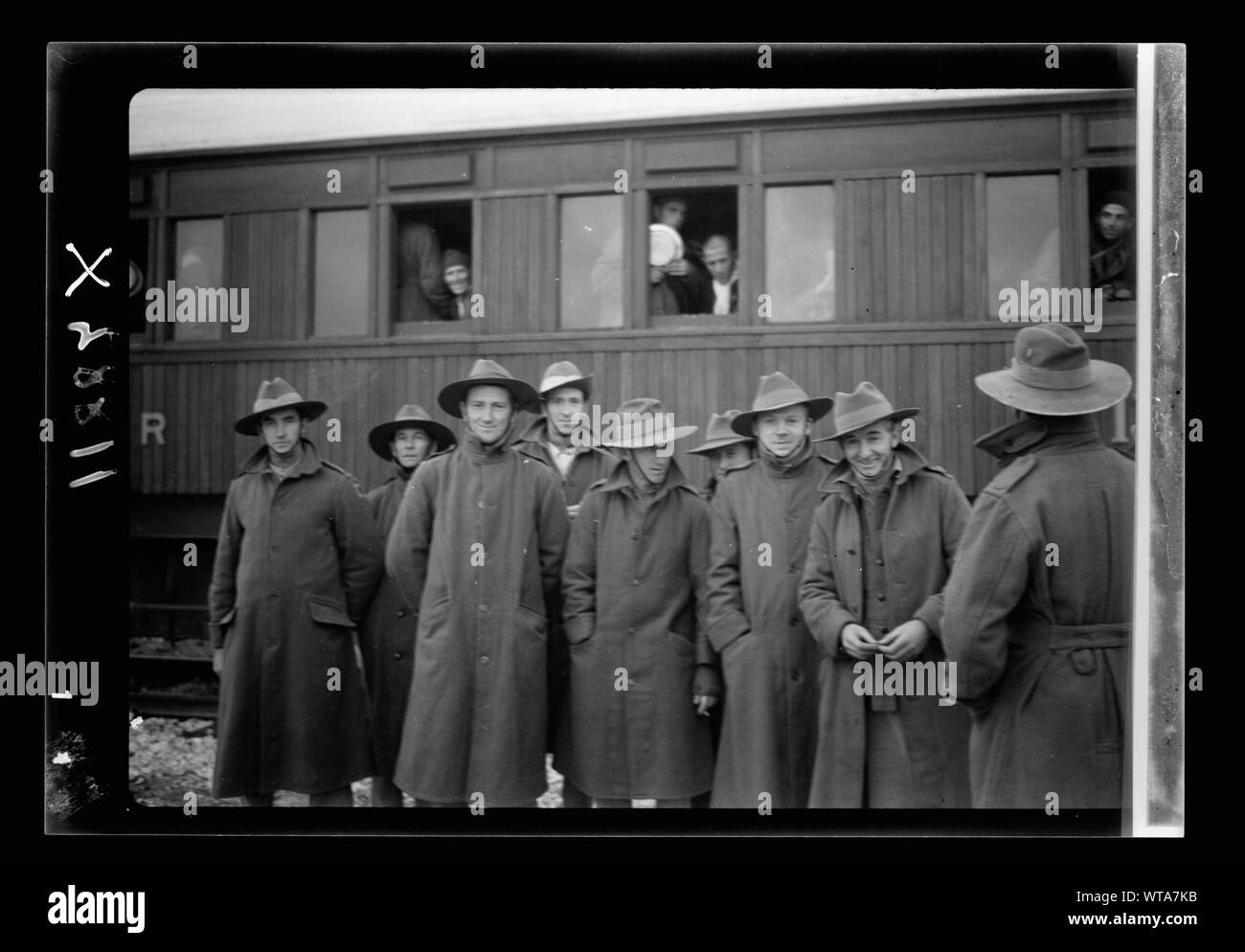 Men standing in front of train Stock Photo - Alamy