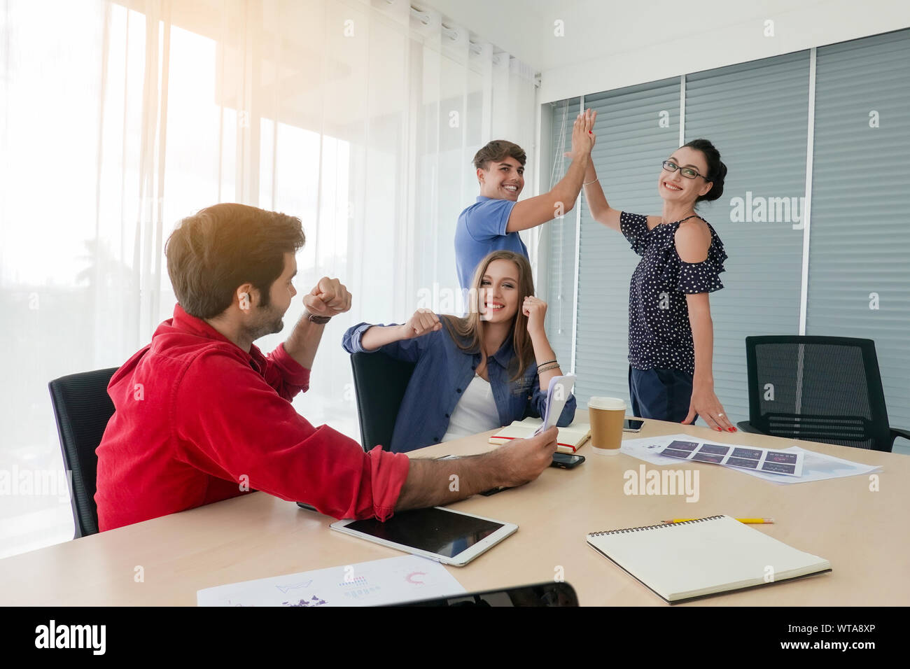 Creative business people working in start up office Group Of Asian and ...