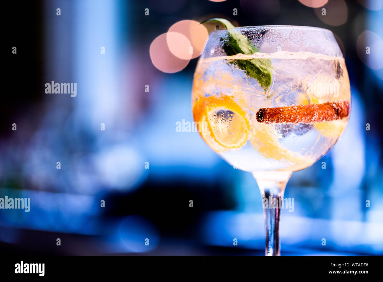 Beautiful glass of gin on bar counter, with blurred background. Hero ...