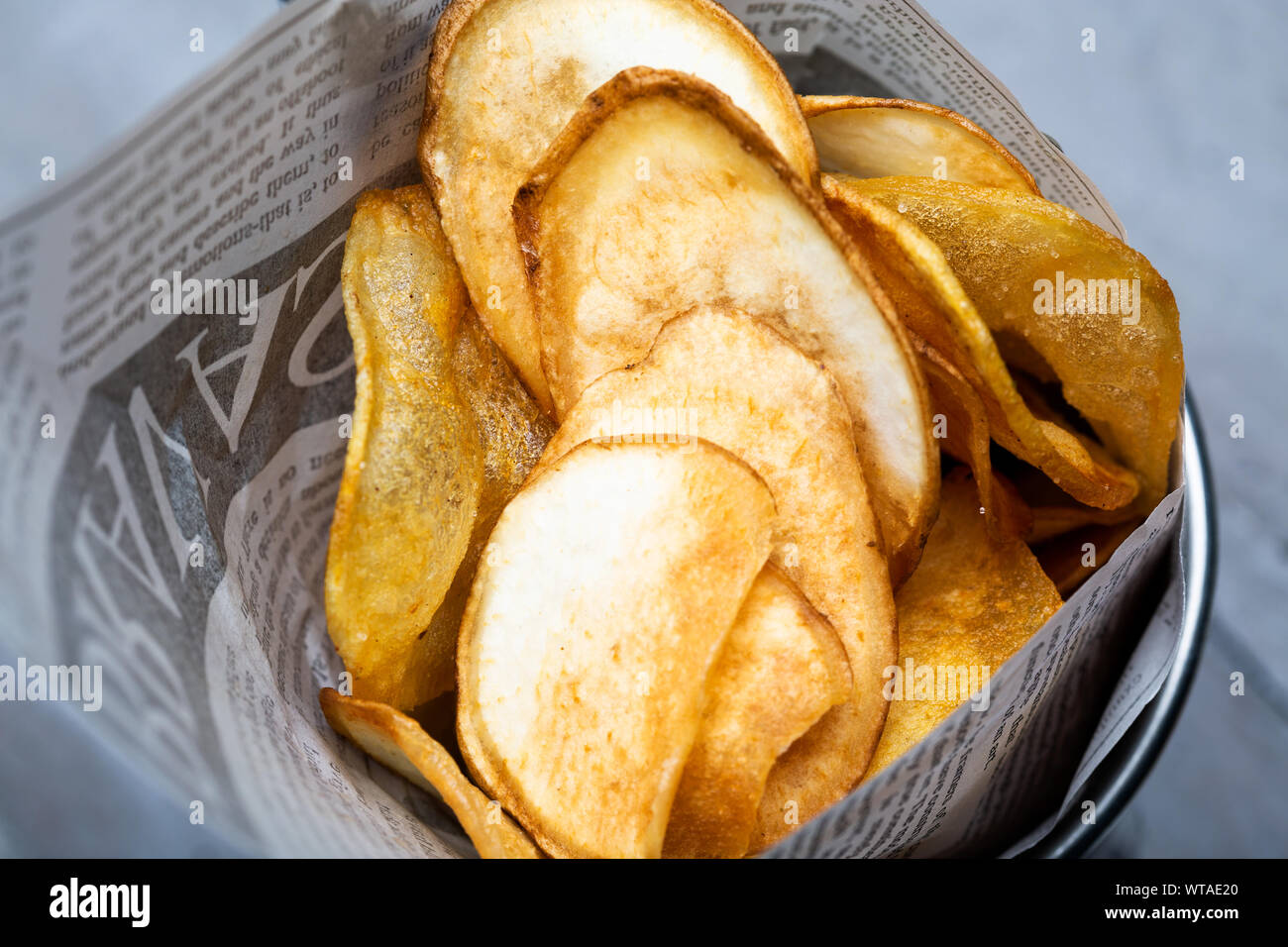 Container with chips. Homemade product Stock Photo - Alamy