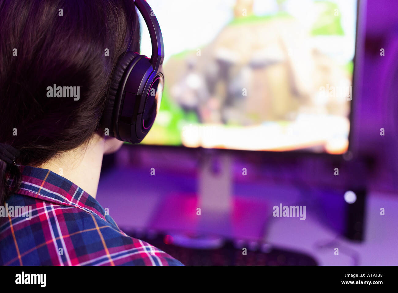 Girl gamer or streamer playing games on computer Stock Photo - Alamy