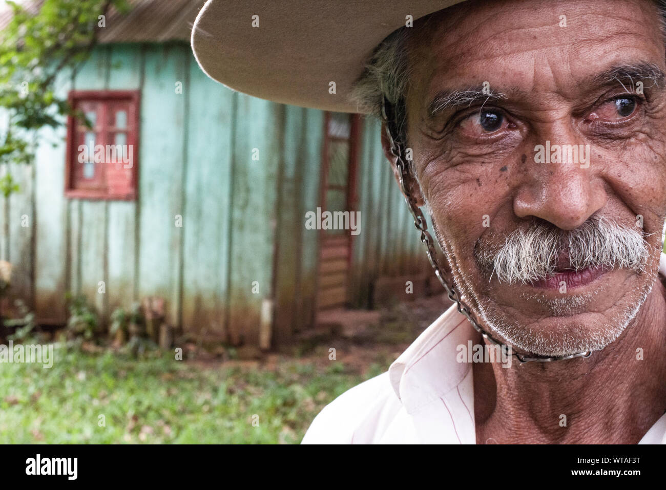 Country man in the yard of his house Stock Photo - Alamy