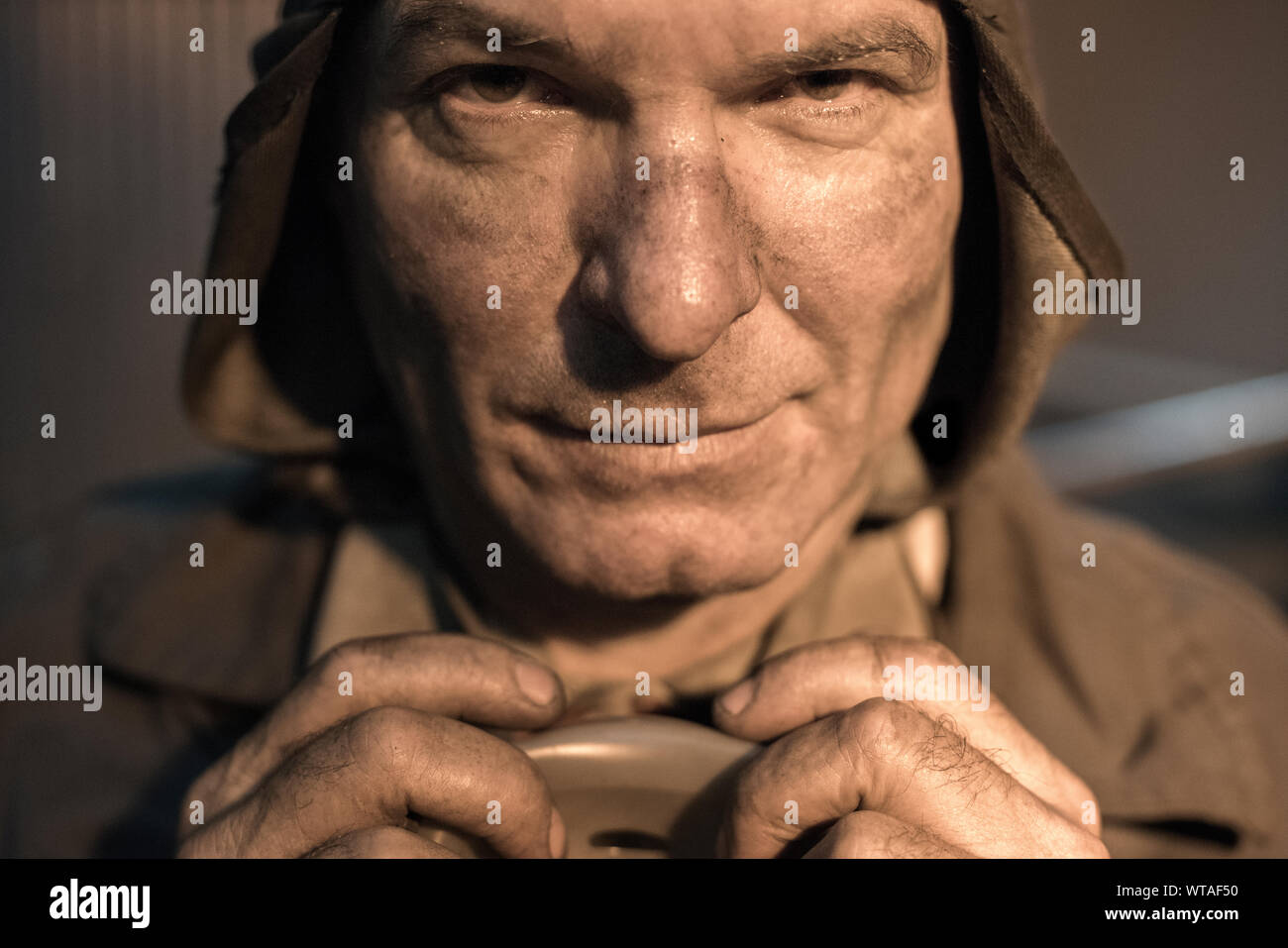 Metallurgical worker with soot and grease on his face Stock Photo - Alamy