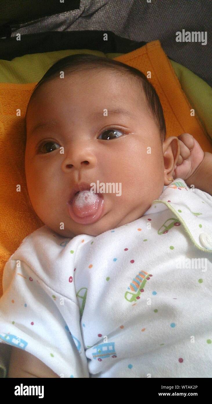 Baby sticking out tongue hi-res stock photography and images - Alamy