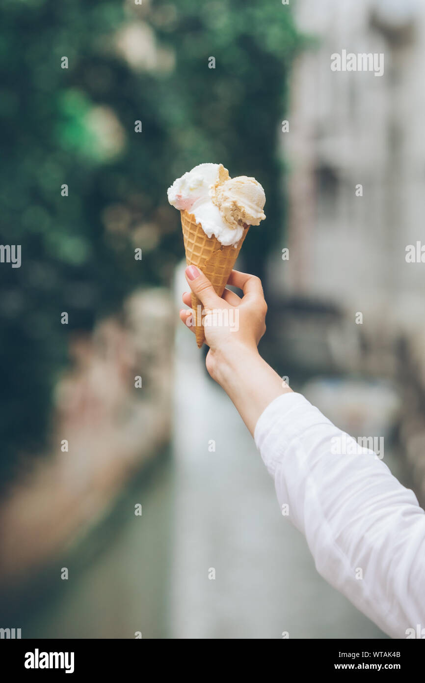 ice cream in woman hand Stock Photo - Alamy