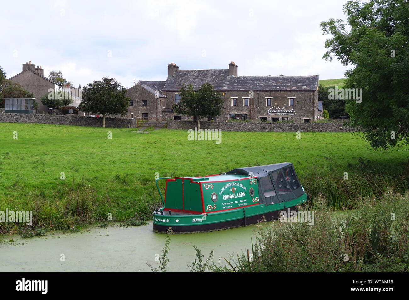 Canal boat on the Lancaster Canal at Crooklands, Cumbria Stock Photo ...