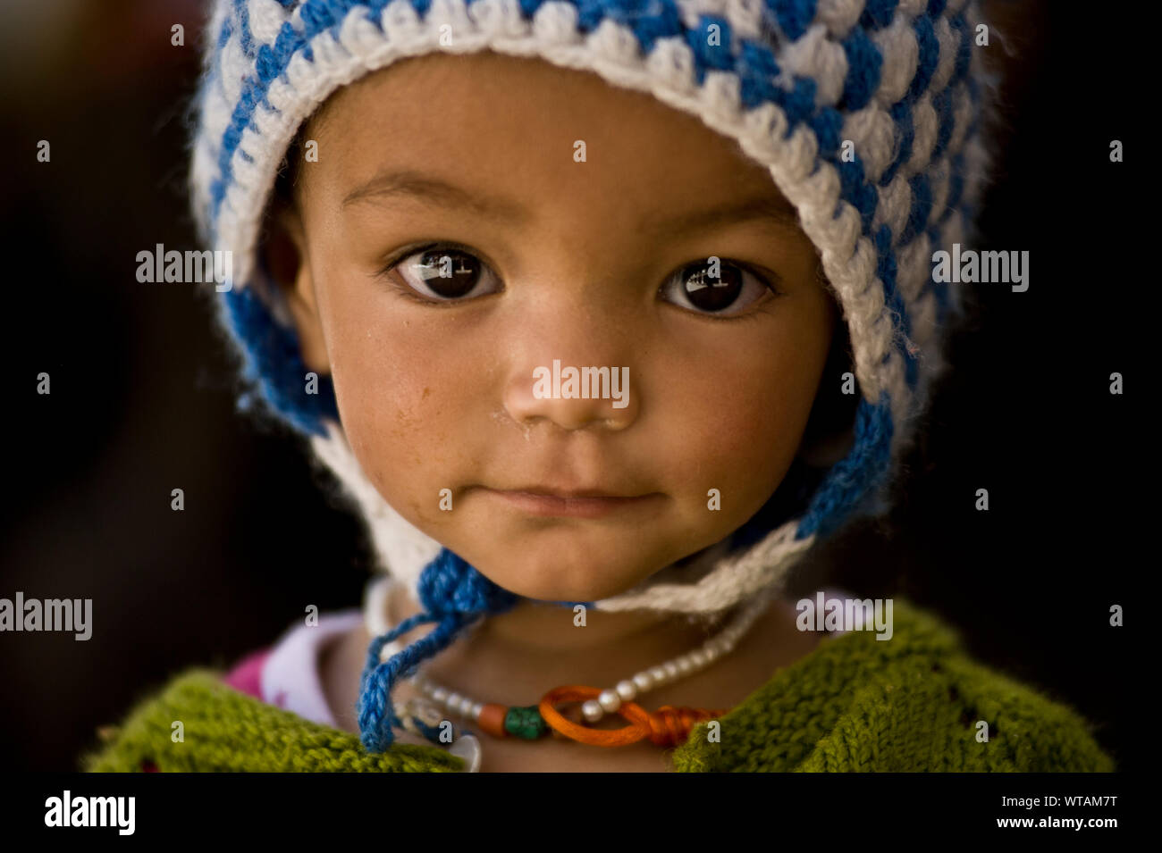 Cute little kid wearing a wool cap and traditional garment Stock Photo ...