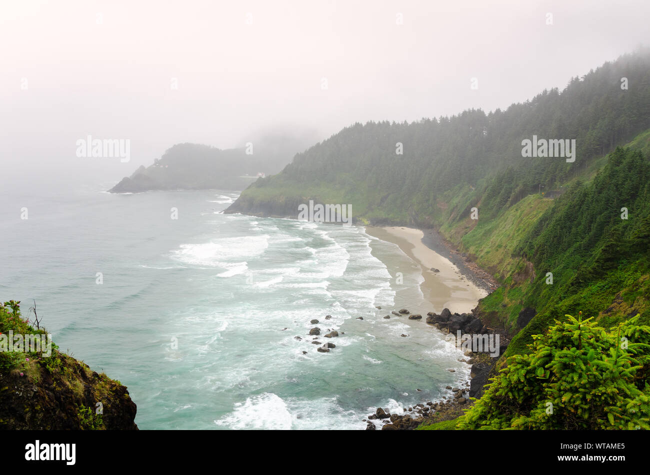 Bay along the coast of Oregon on a foggy summer day Stock Photo - Alamy