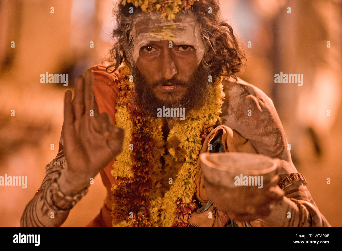 Sadhu in Chin mudra gesture in the streets of Varanasi Stock Photo - Alamy