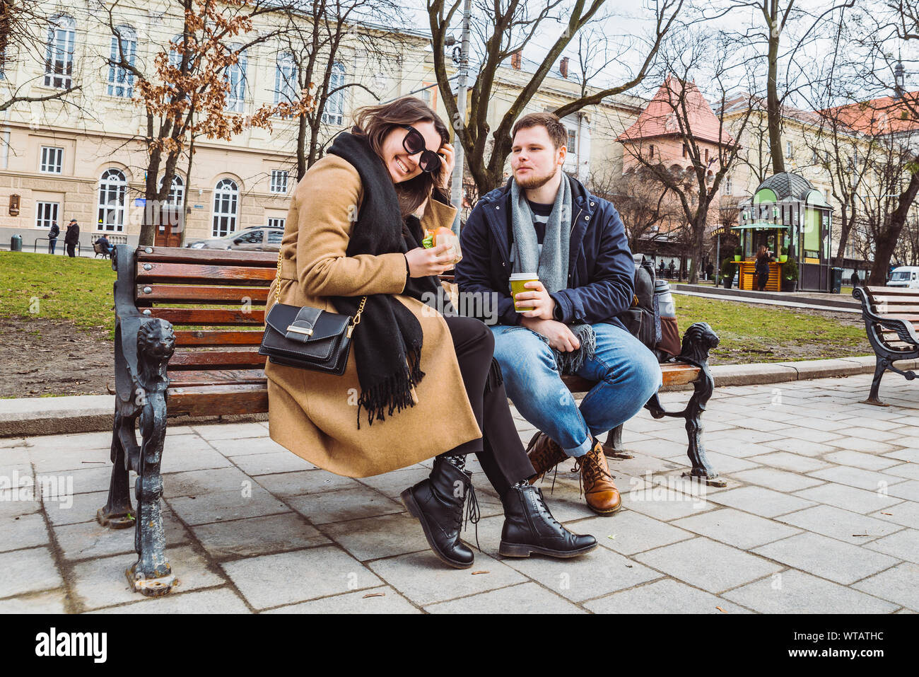 Woman eating burger bench hi-res stock photography and images - Alamy