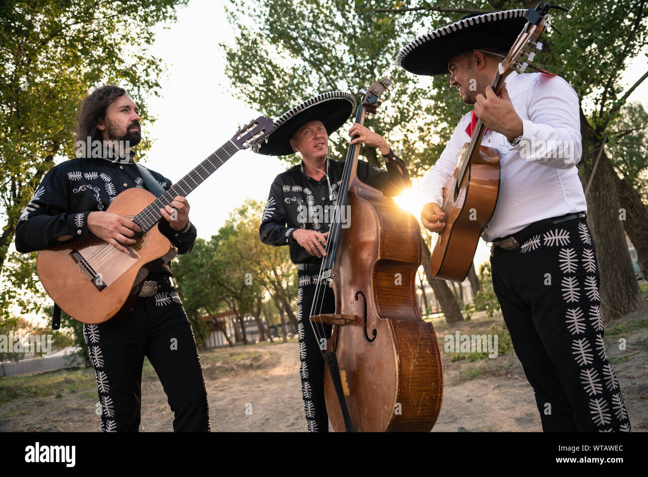 Mexican musicians mariachi band give street concert Stock Photo - Alamy