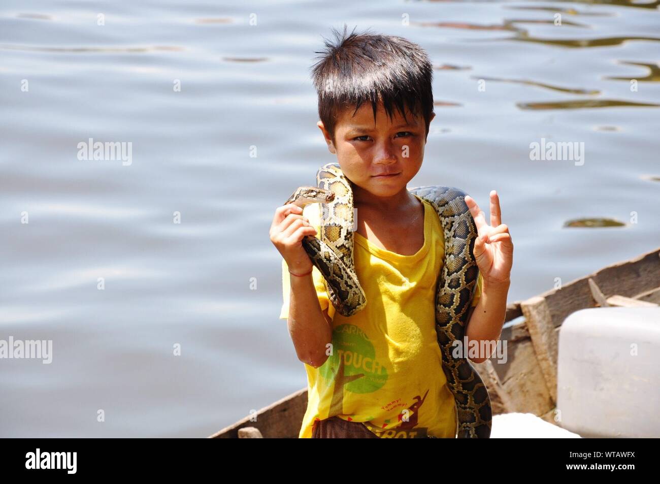 Boy Holding Snake High Resolution Stock Photography and Images - Alamy