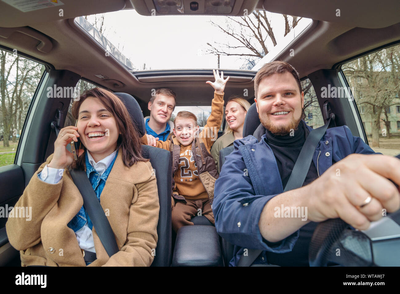car travel concept. people in car rise up hands Stock Photo - Alamy