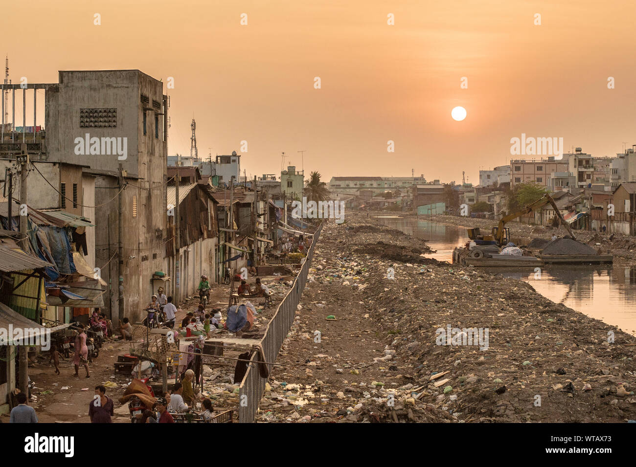 Sunset in a riverside Saigon slum Stock Photo - Alamy