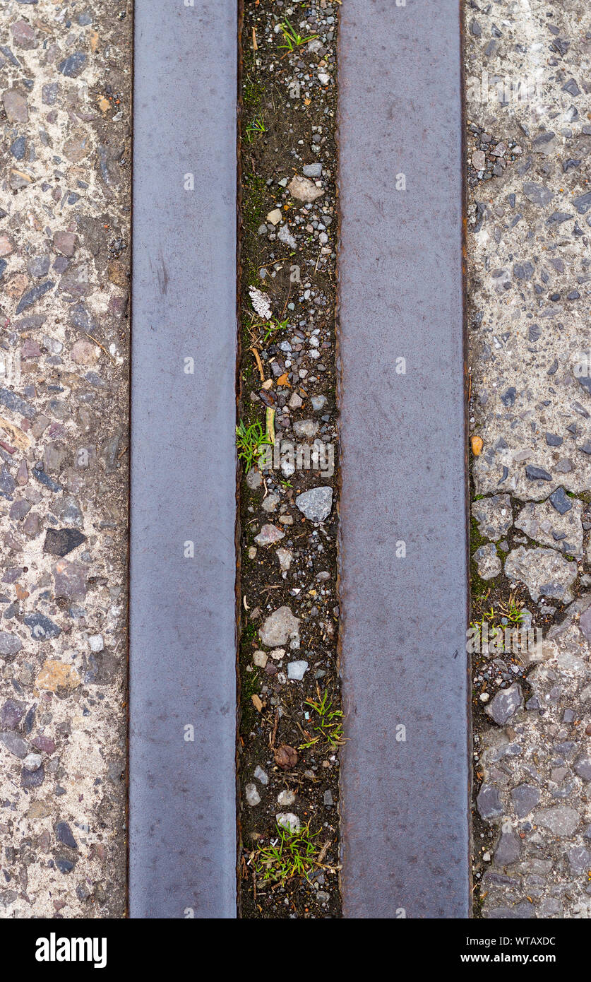 Top closeup view of two parallel vertical steel rail lines Stock Photo ...